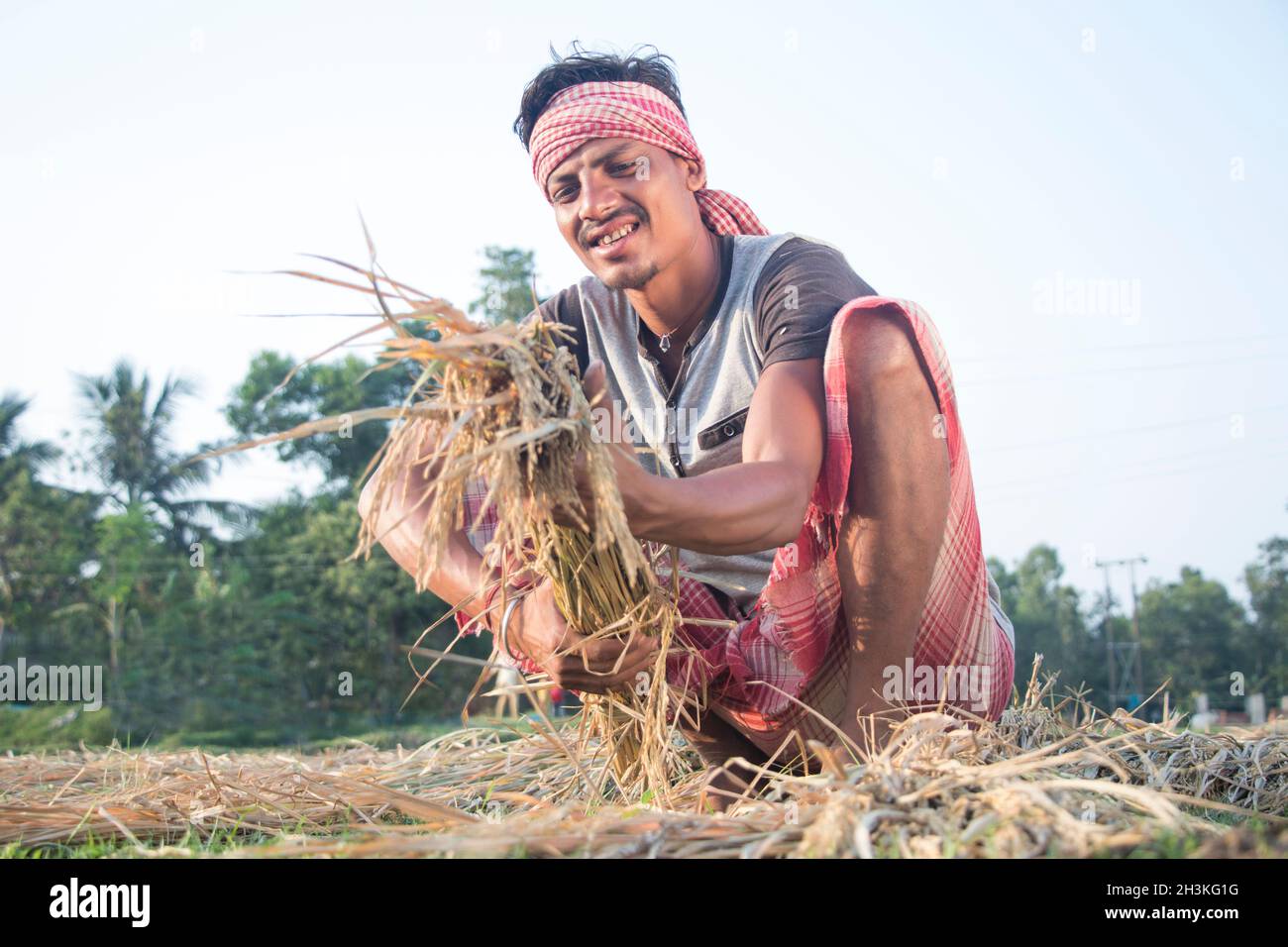 Indian rural man working on the pond at village Stock Photo - Alamy