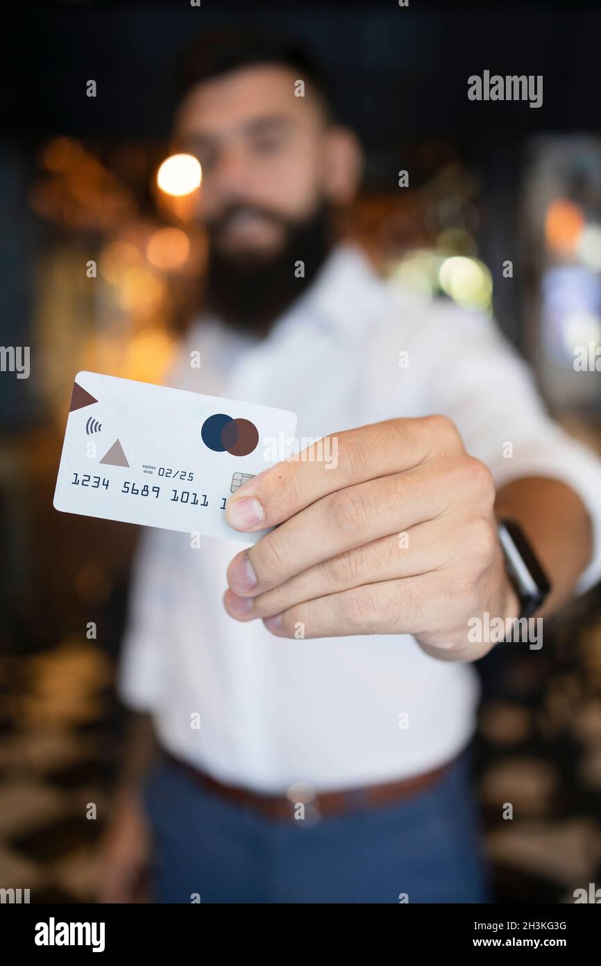 Black man holding bank card hi-res stock photography and images - Alamy