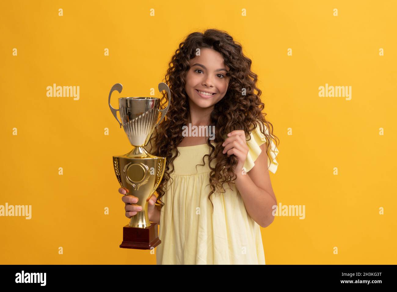 Child winning trophy hi-res stock photography and images - Alamy