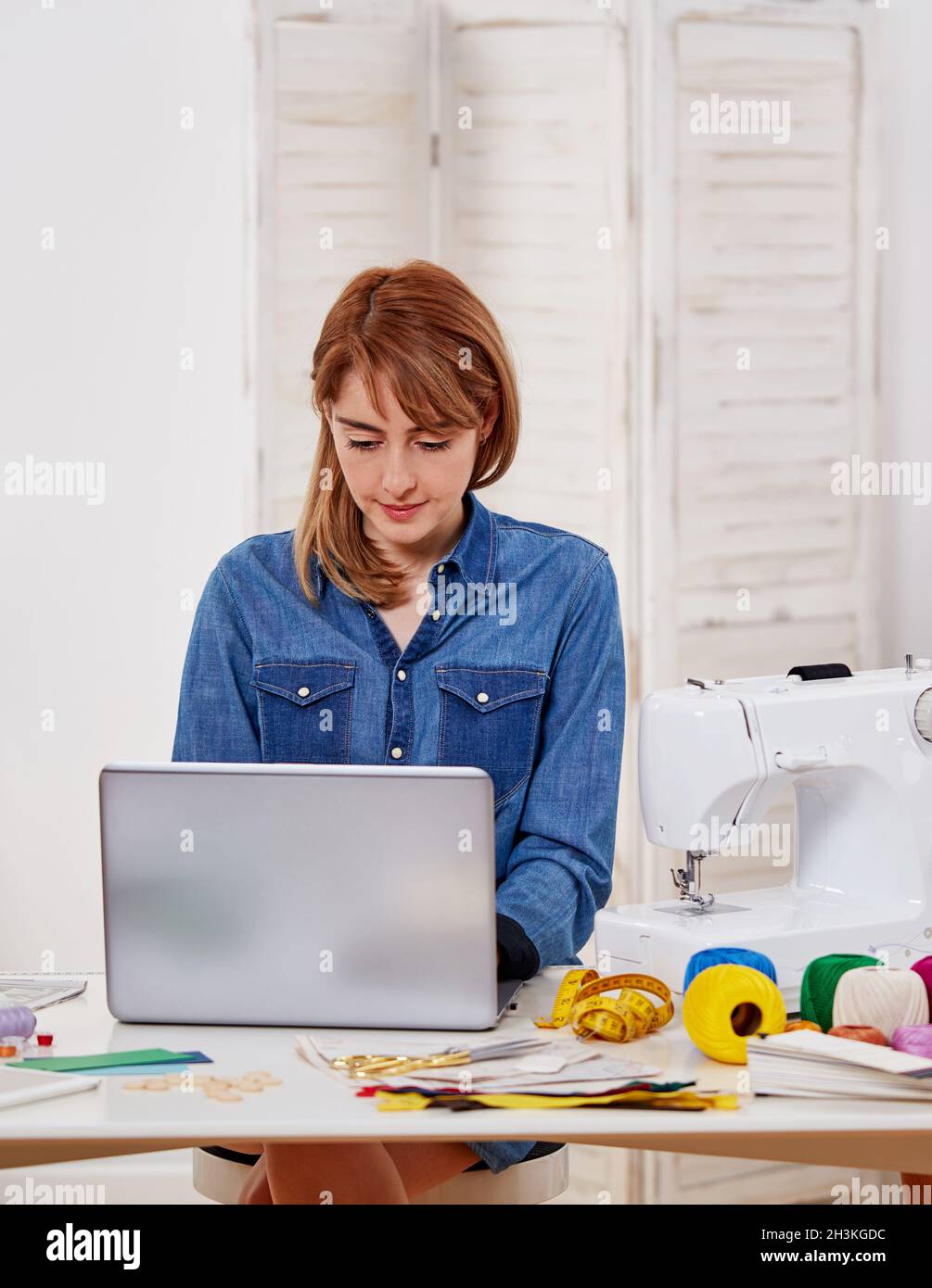 Standing smiling seamstress in hi-res stock photography and images - Alamy