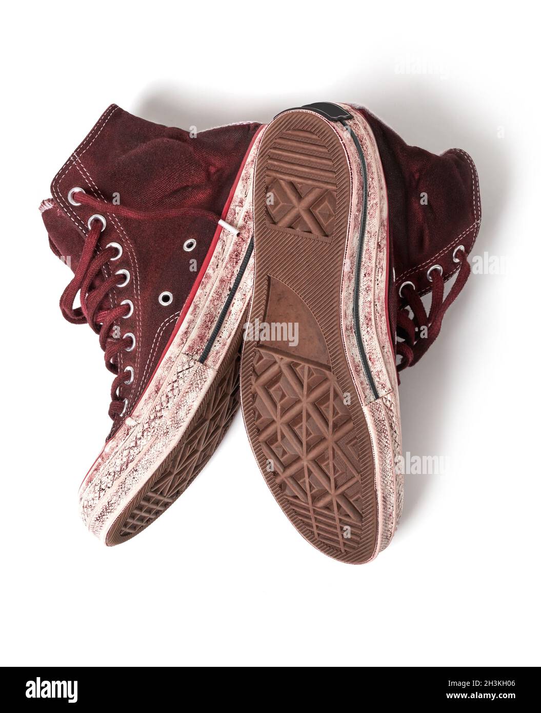 Used canvas shoes on white background Stock Photo - Alamy