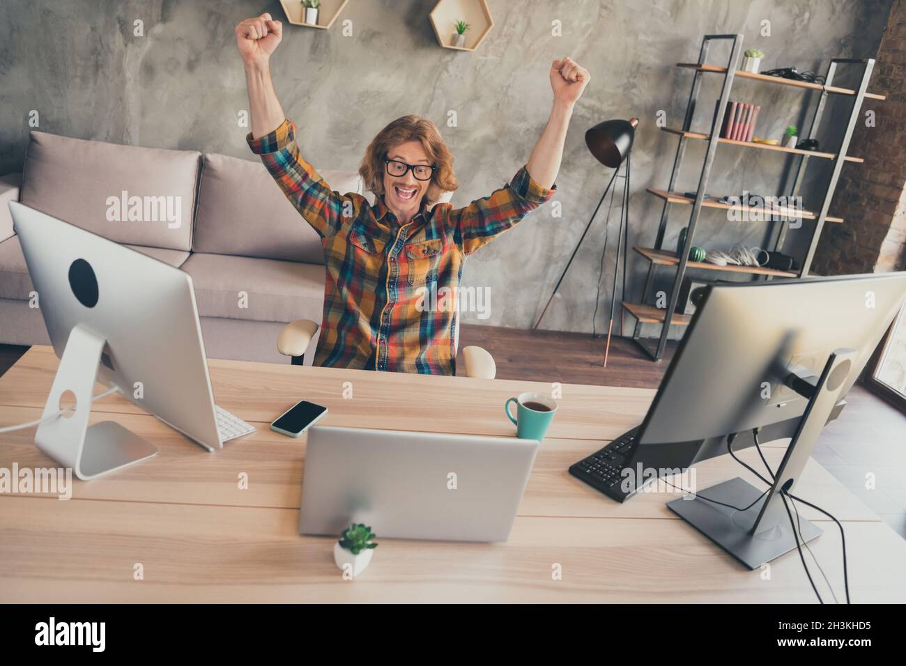 Photo of young guy happy positive smile celebrate victory lucky fists ...