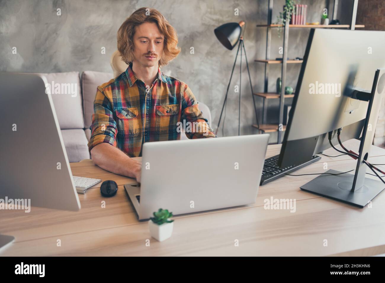 Photo of young guy it specialist programmer look laptop work jawascript ...