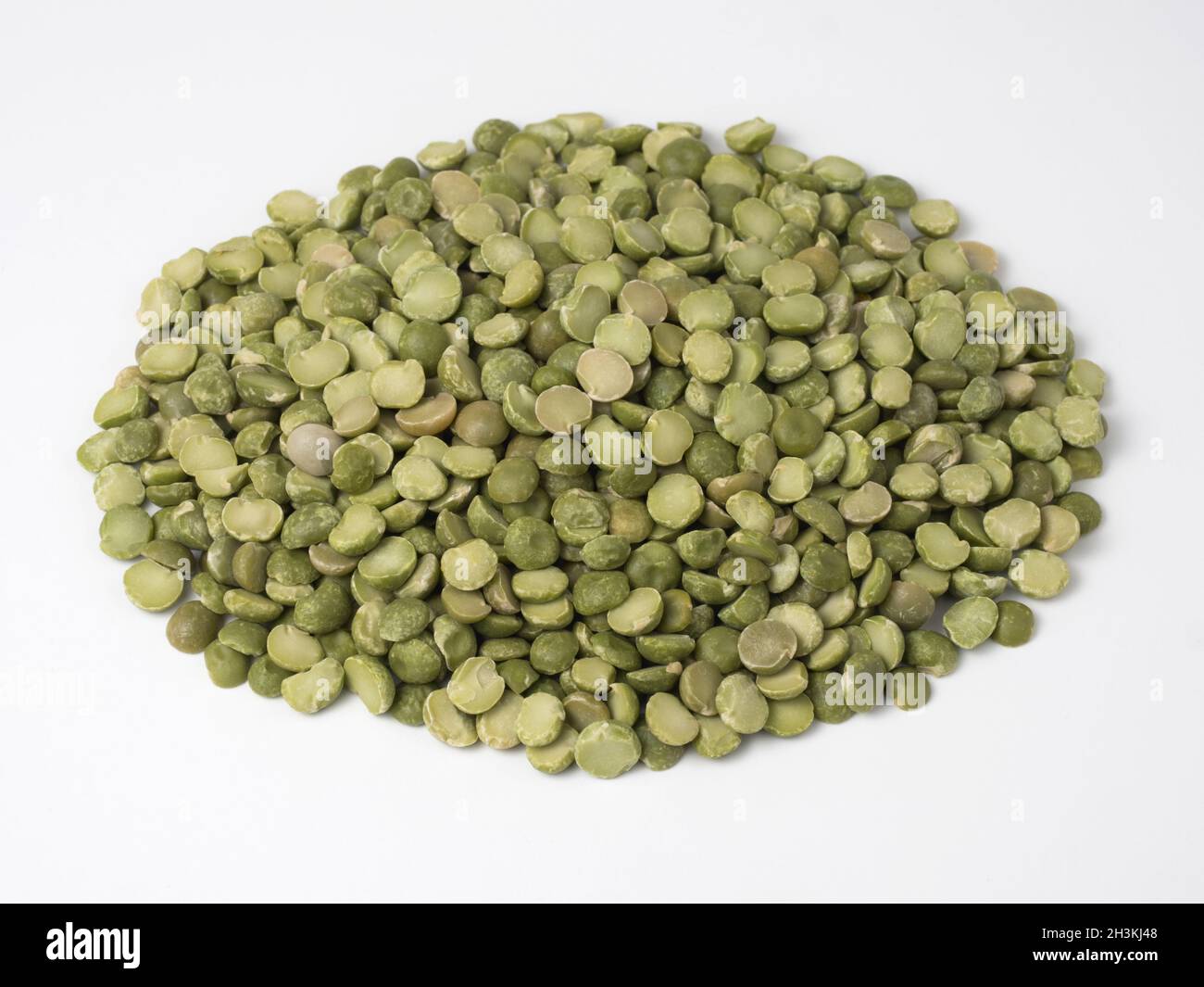 Green dry peas in a pile isolated on a white background Stock Photo - Alamy