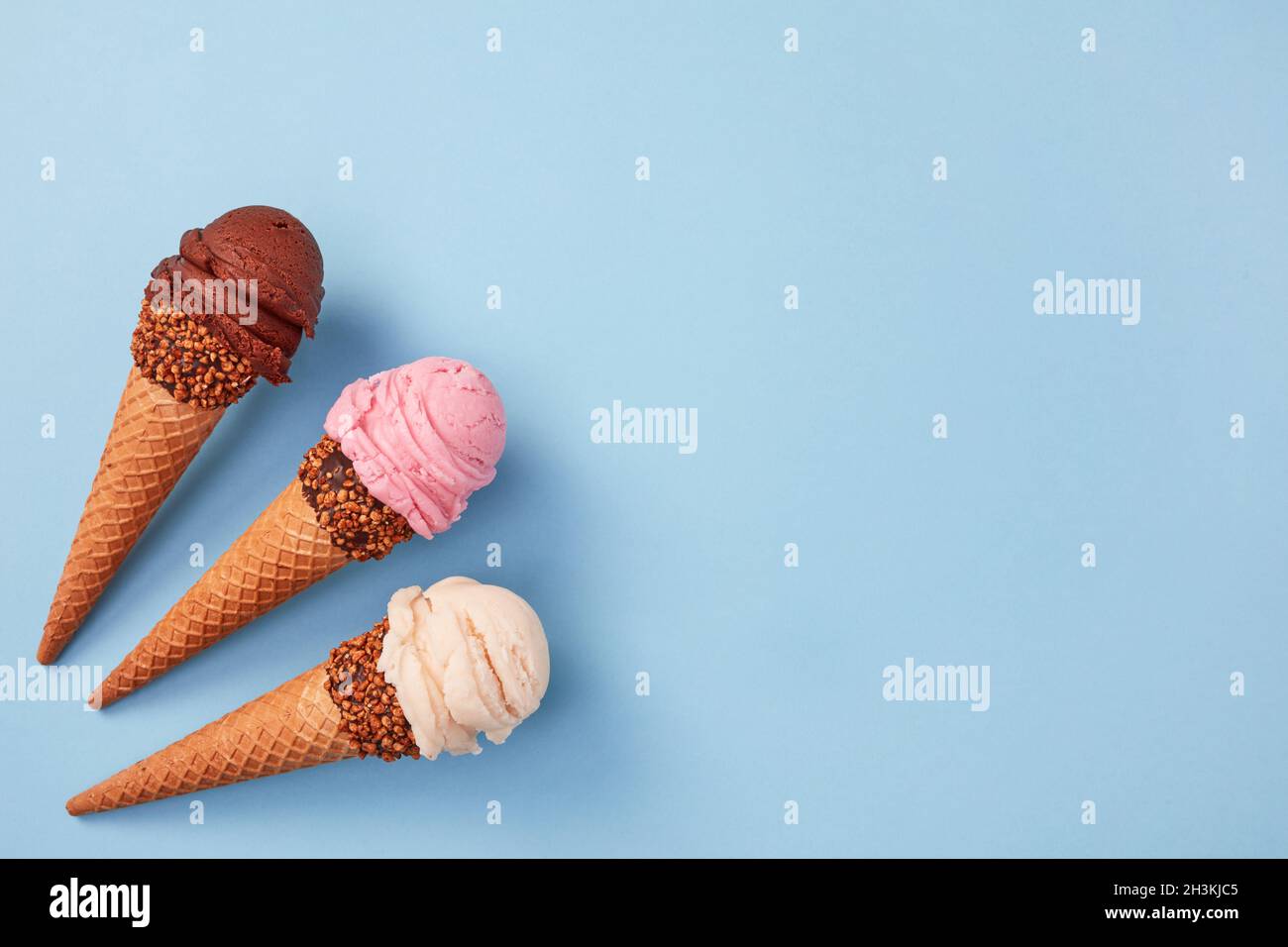 Ice cream cones on blue background Stock Photo - Alamy