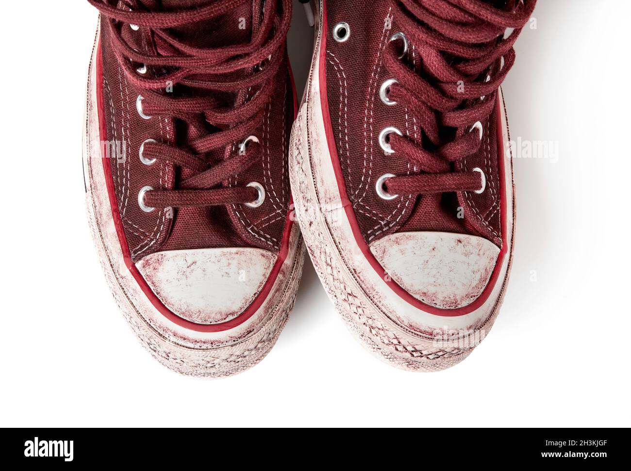 Used canvas shoes close-up on white background Stock Photo - Alamy