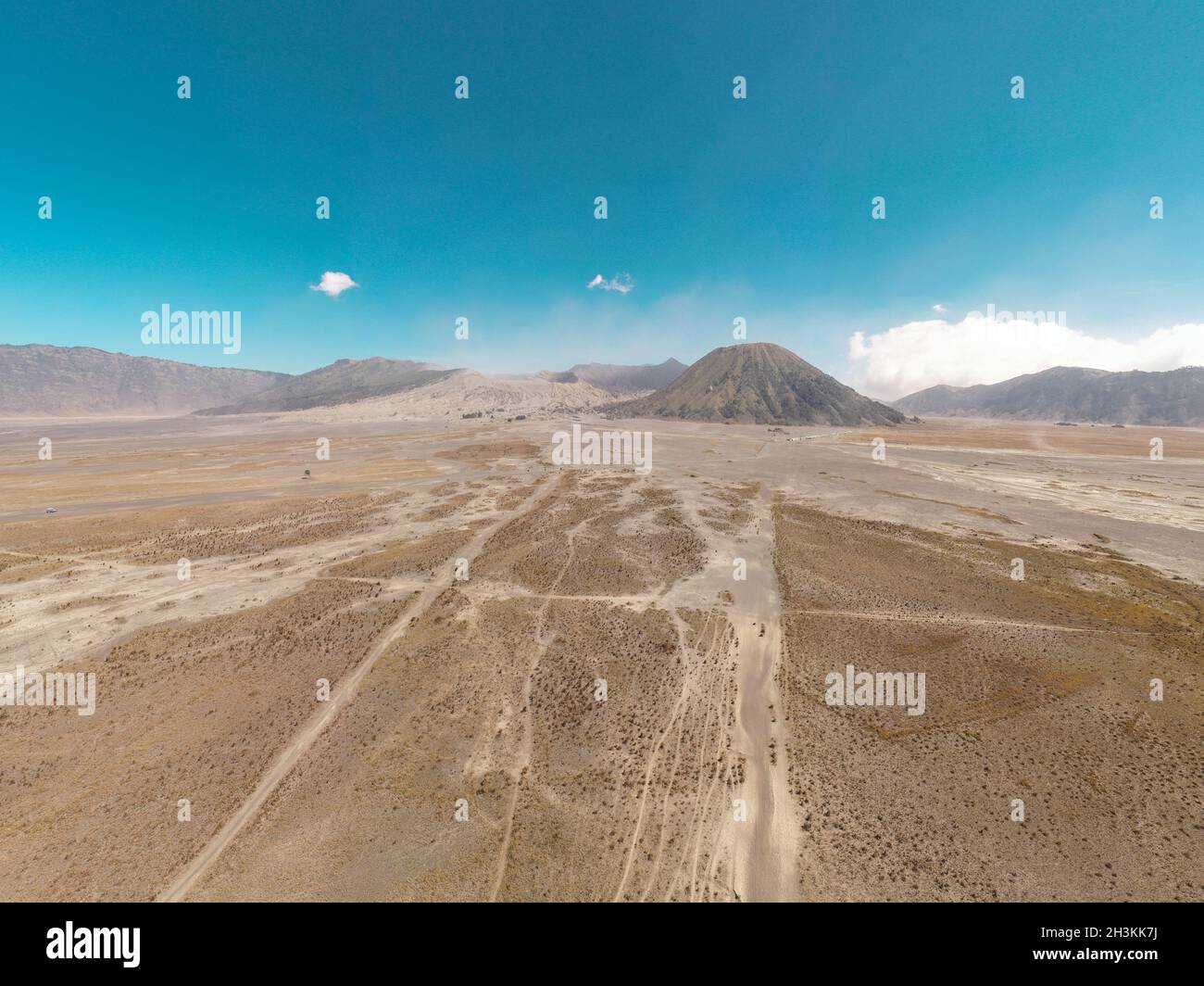 Cinematic shot aerial view of beautiful Mount Bromo volcano with desert ...