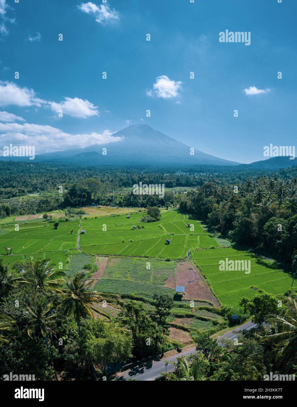 Aerial view of volcano and beautiful fields landscape during sunny ...