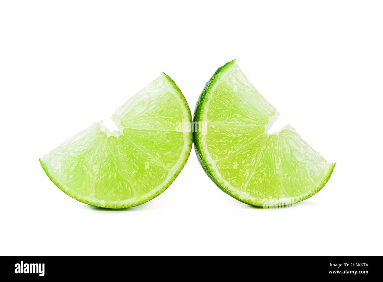 Pieces of lime isolated on white background Stock Photo - Alamy
