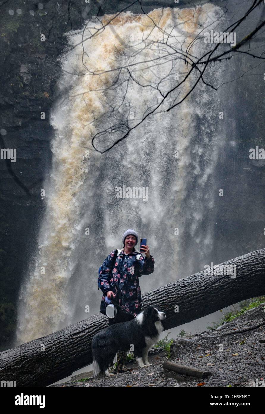A women takes a selfie at Henryd Falls in the Brecon Beacons, Wales, as ...