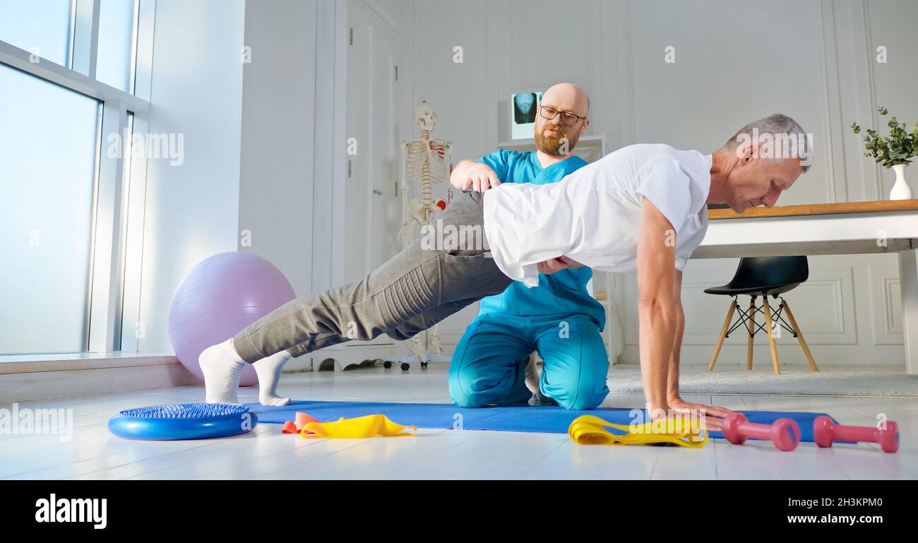 A Physical Therapist Safely Trains a Patient Using Medical Exercise ...