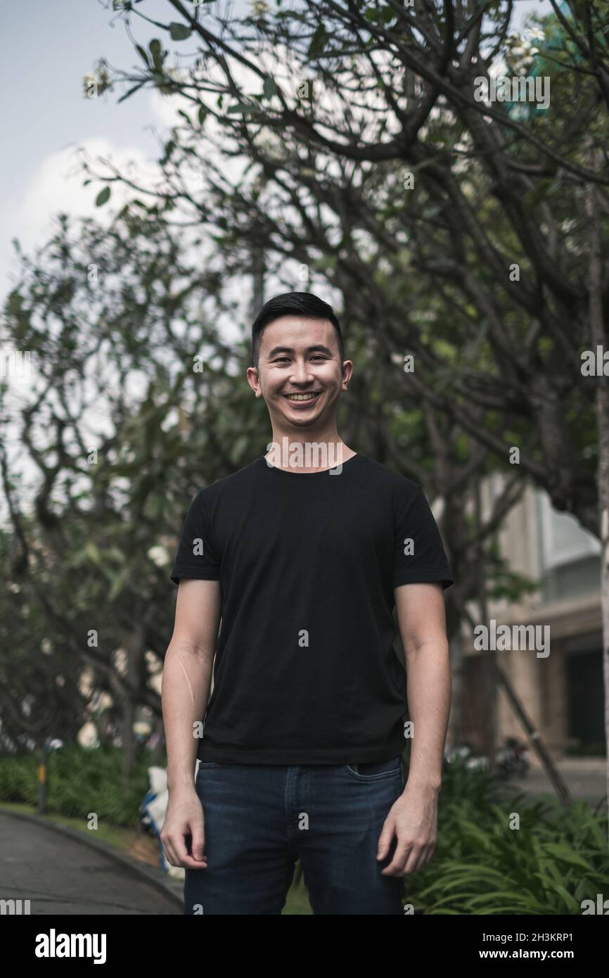 Portrait of asian young handsome man in casual clothing standing on the ...