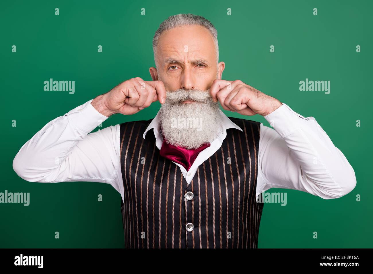 Photo of serious rich man touch moustache look camera wear formal ...