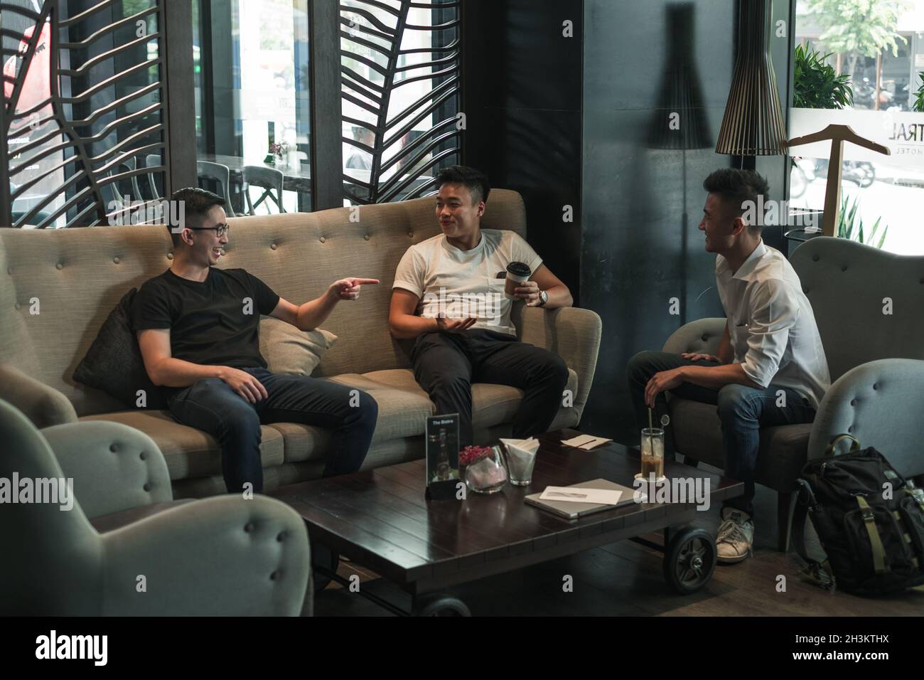Male friends enjoying in coffee shop hi-res stock photography and ...
