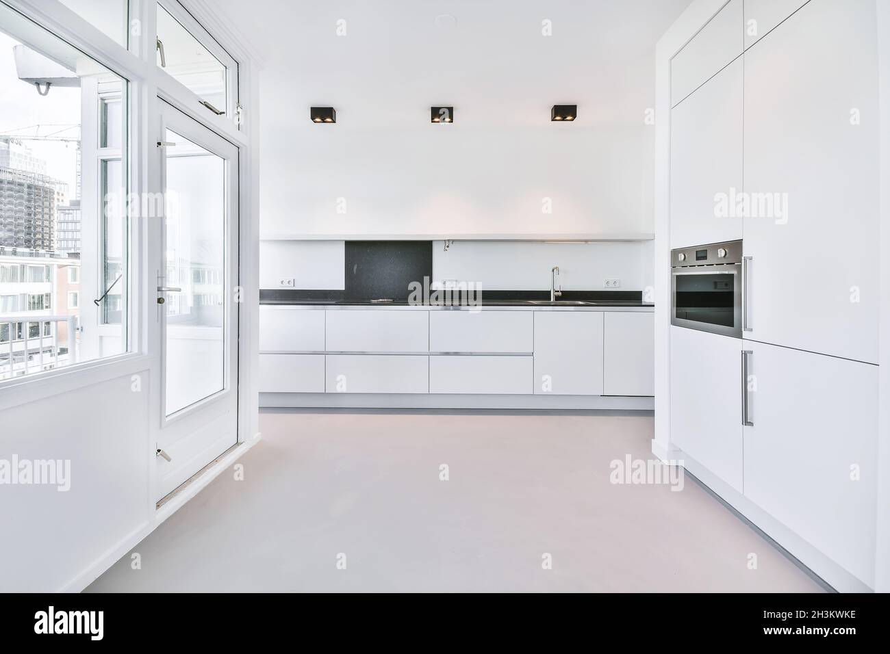 Interior of pretty kitchen in luxury apartment Stock Photo - Alamy