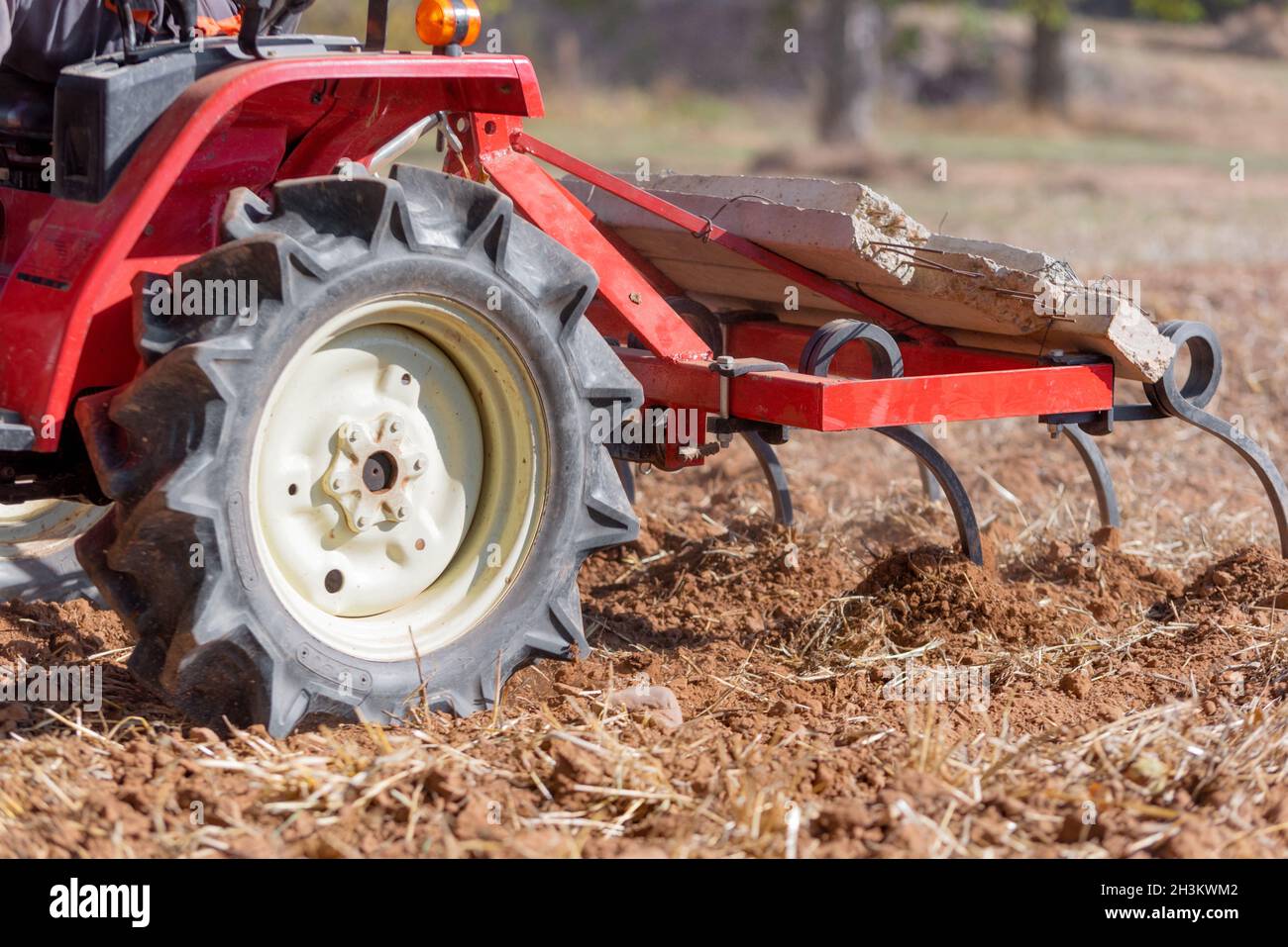 Red Tractor With Plough Plowing Field Soil Close Up View Stock Photo ...