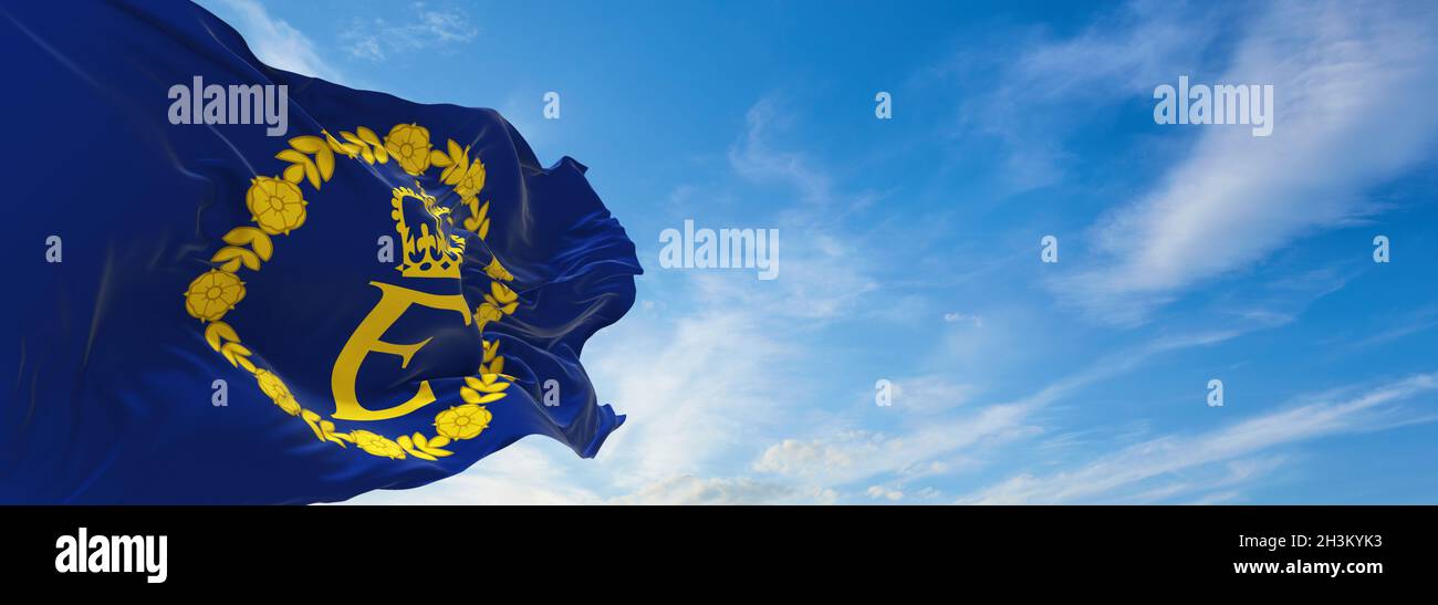 flag of Personal Queen Elizabeth II at cloudy sky background on sunset ...
