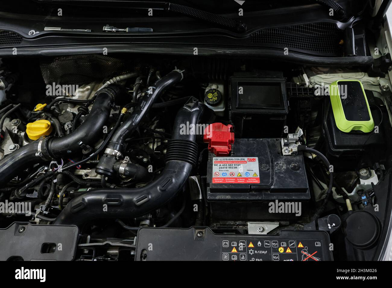 A garage owner installs a FlexFuel kit for switching to E-85 fuel ...