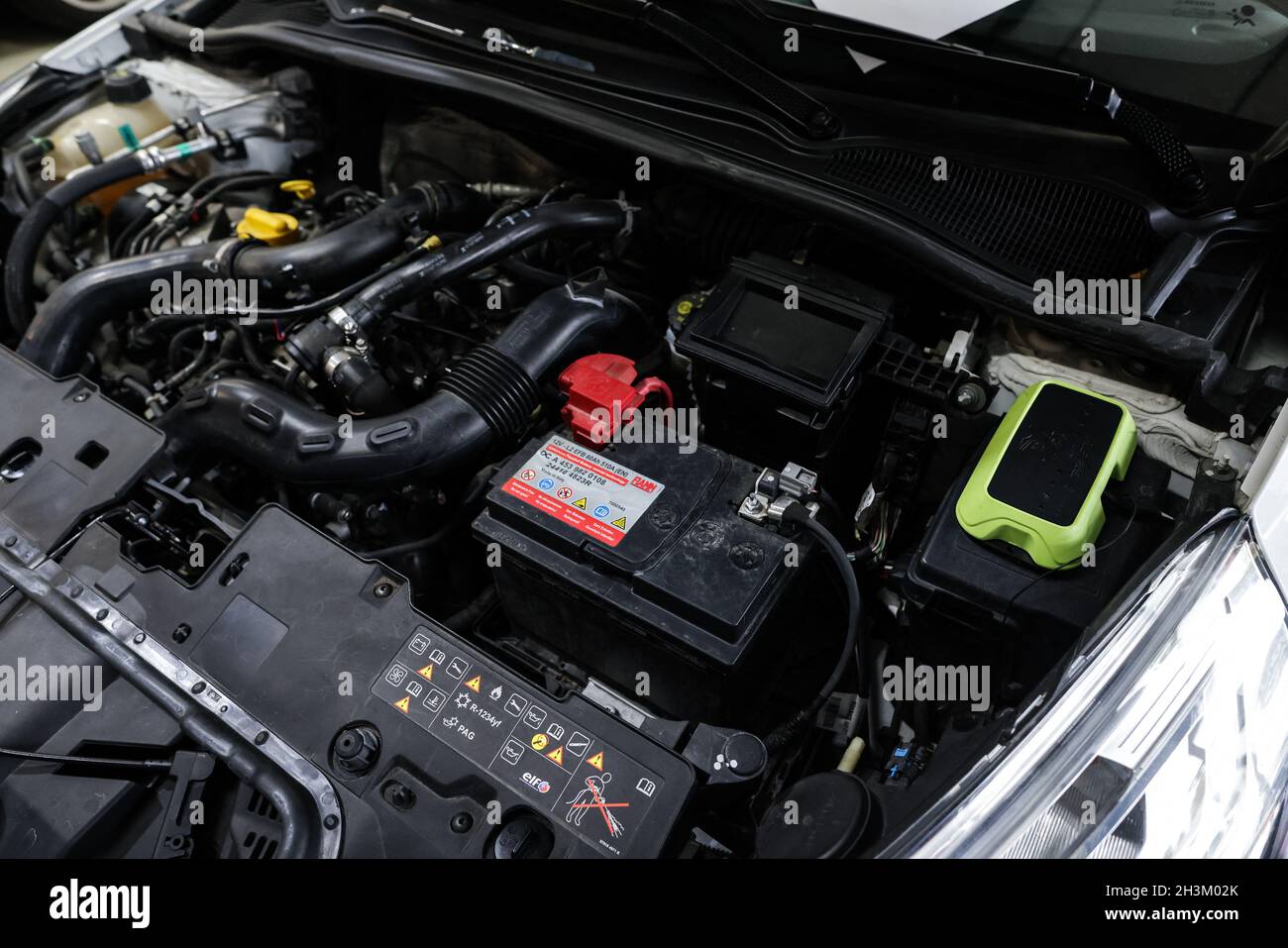 A garage owner installs a FlexFuel kit for switching to E-85 fuel ...