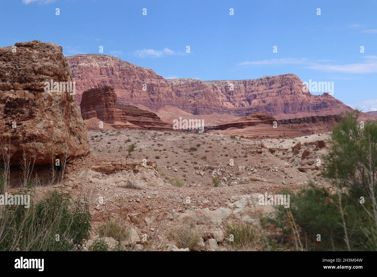 Mesa among rugged layered red rock dramatic desert landscape at the ...
