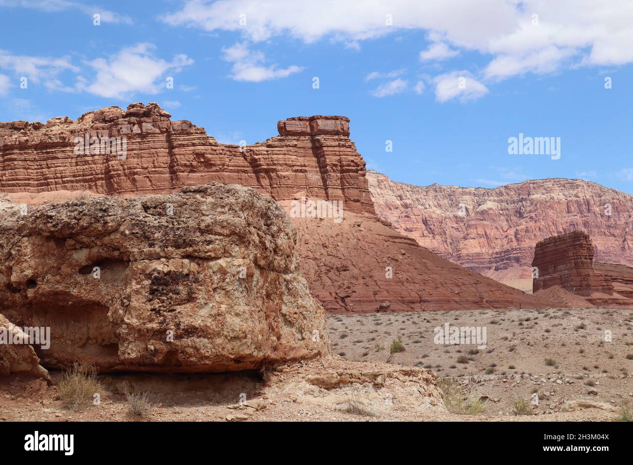 Mesa among rugged layered red rock dramatic desert landscape at the ...