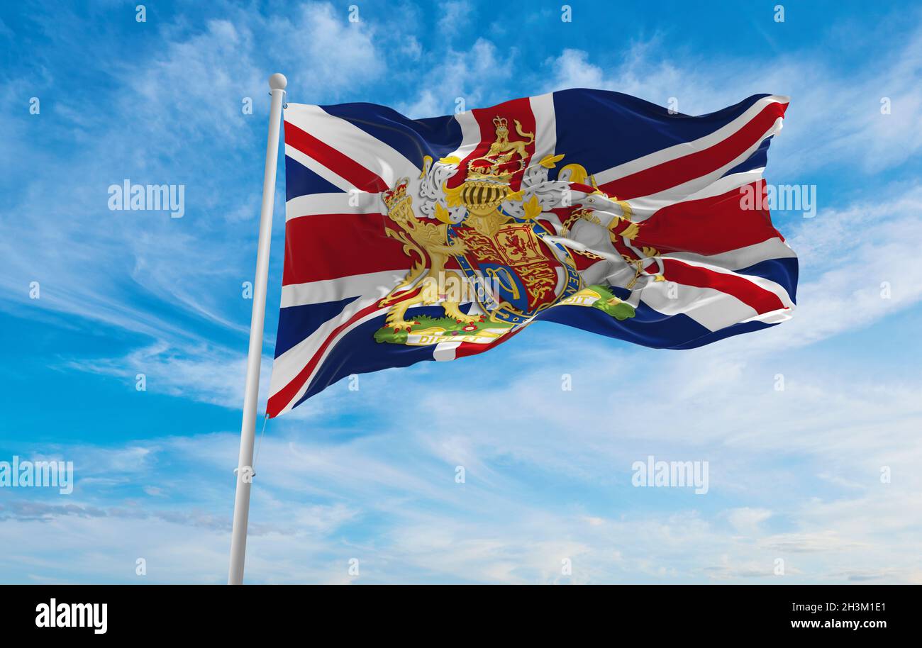 flag of Royal Arms of England on United Kingdom at cloudy sky ...