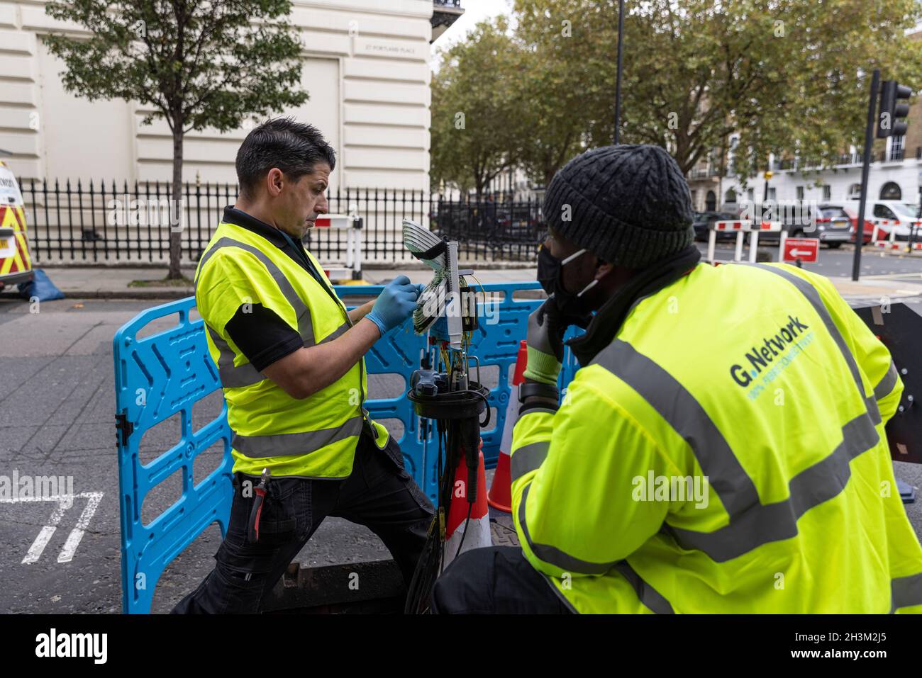 'G.Network' engineers connecting fibre broadband internet network ...