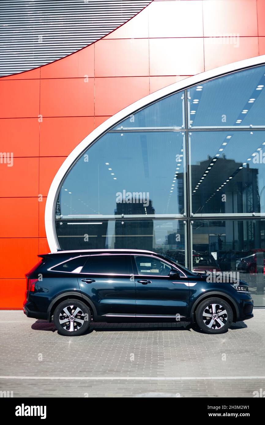 Side view of turning luxury grey car Stock Photo - Alamy