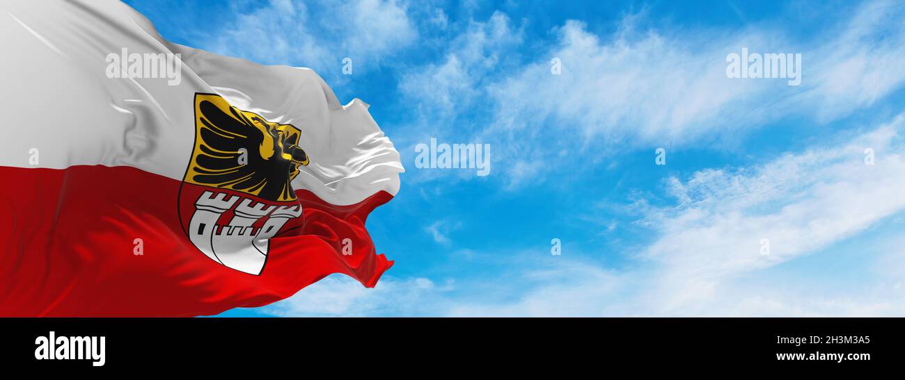 flag of Duisburg mit Wappen at cloudy sky background on sunset ...