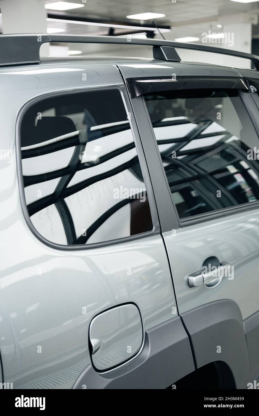 Side view of turning luxury grey car Stock Photo - Alamy