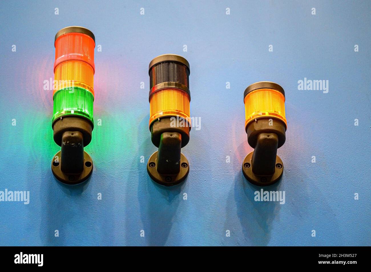 Three Warning lamps on the work of industrial equipment Stock Photo - Alamy