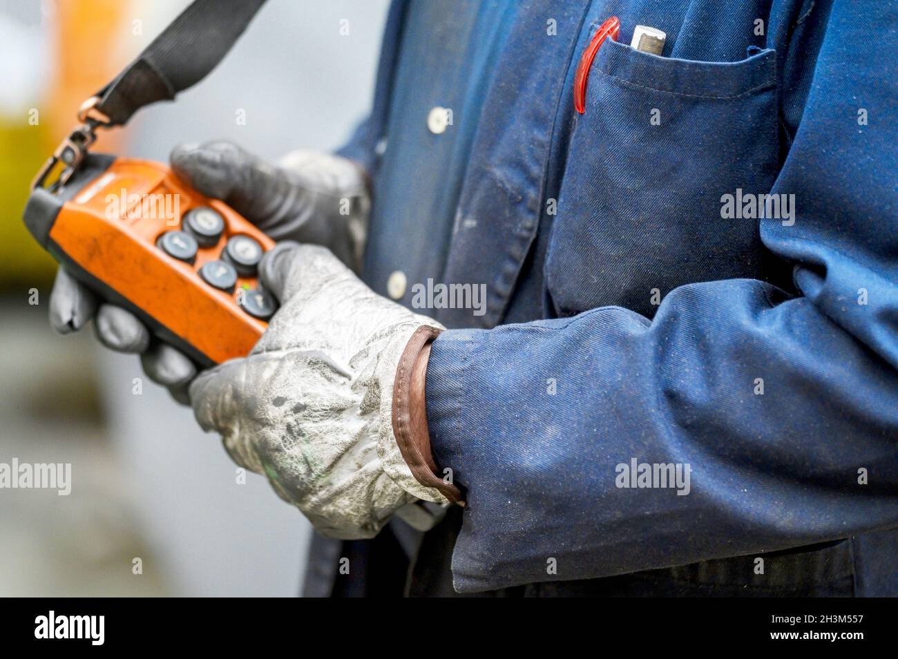 Male hand push remote control switch for overhead crane in the factory ...