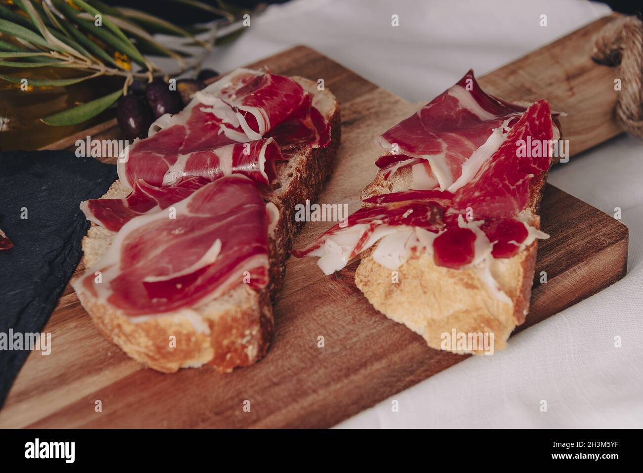 Typical Spanish leg of acorn-fed Serrano ham Stock Photo - Alamy