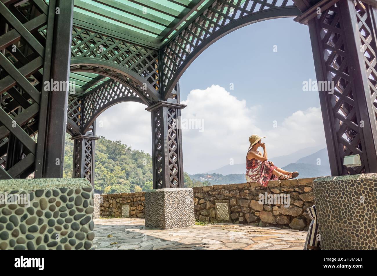 Woman rest at a pavilion Stock Photo - Alamy