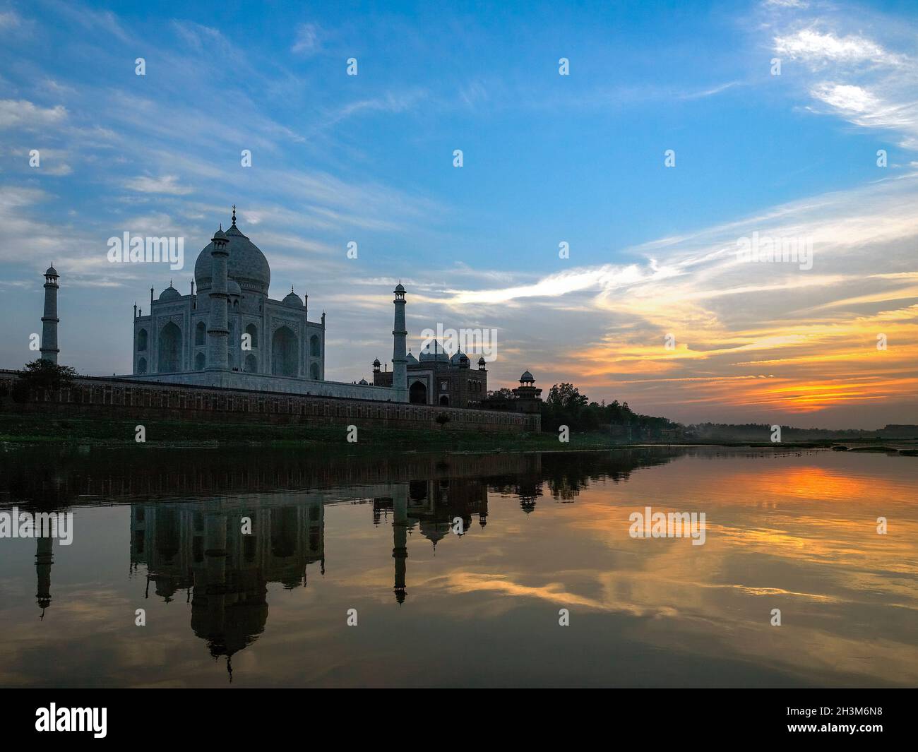 The Taj Mahal and the Yamuna River in the late afternoon sun. The Taj ...