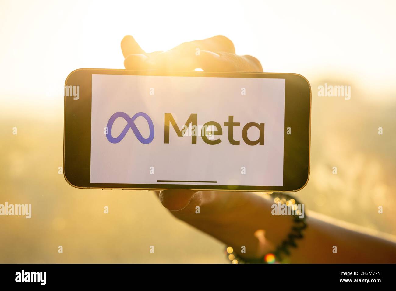 Meta logo on the iPhone. Woman holding smartphone with new facebook ...