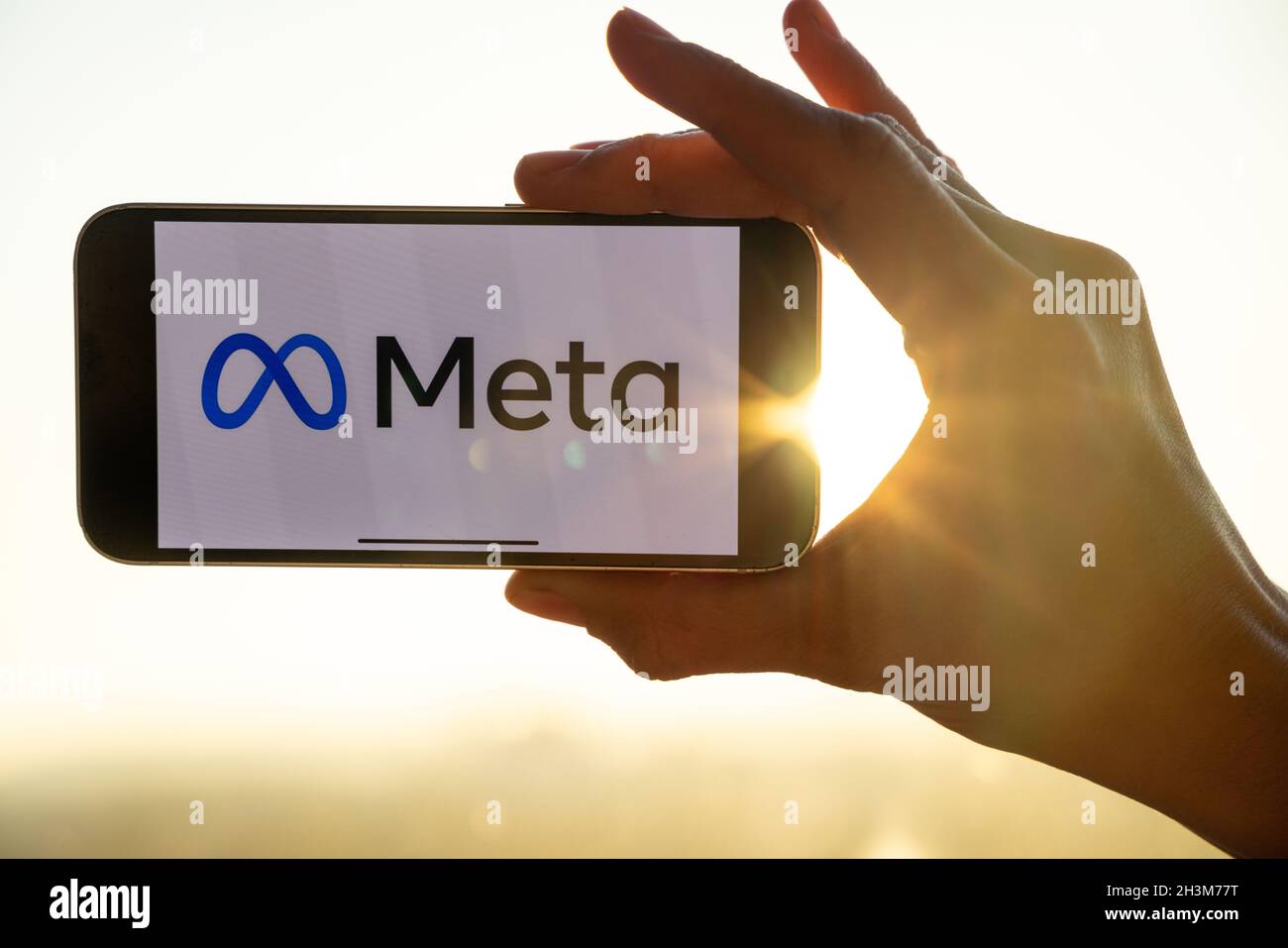 Meta logo on the iPhone. Woman holding smartphone with new facebook ...