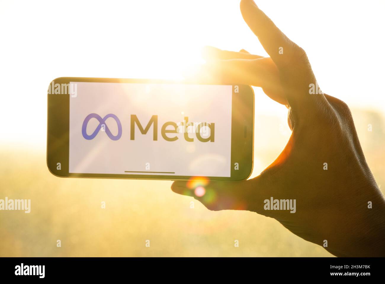 Meta logo on the iPhone. Woman holding smartphone with new facebook ...