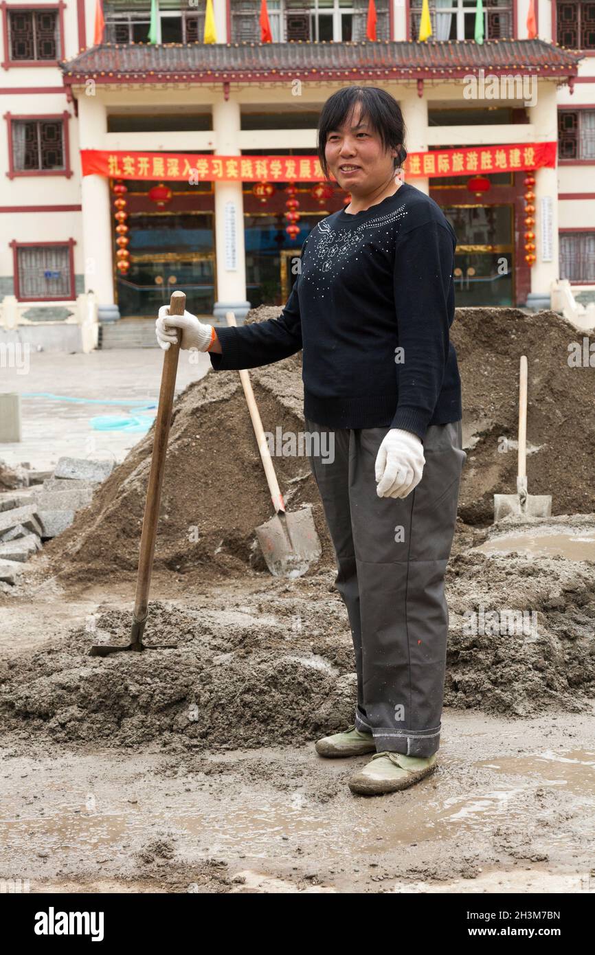 Female woman roadworker / road worker working on repairs and ...