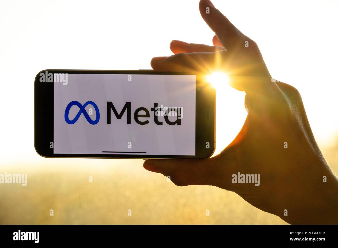 Meta logo on the iPhone. Woman holding smartphone with new facebook ...