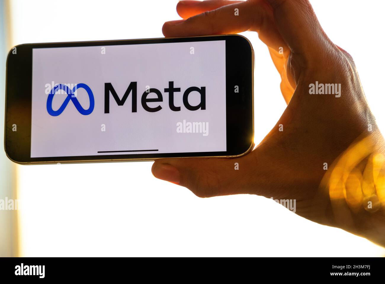 Meta logo on the iPhone. Woman holding smartphone with new facebook ...