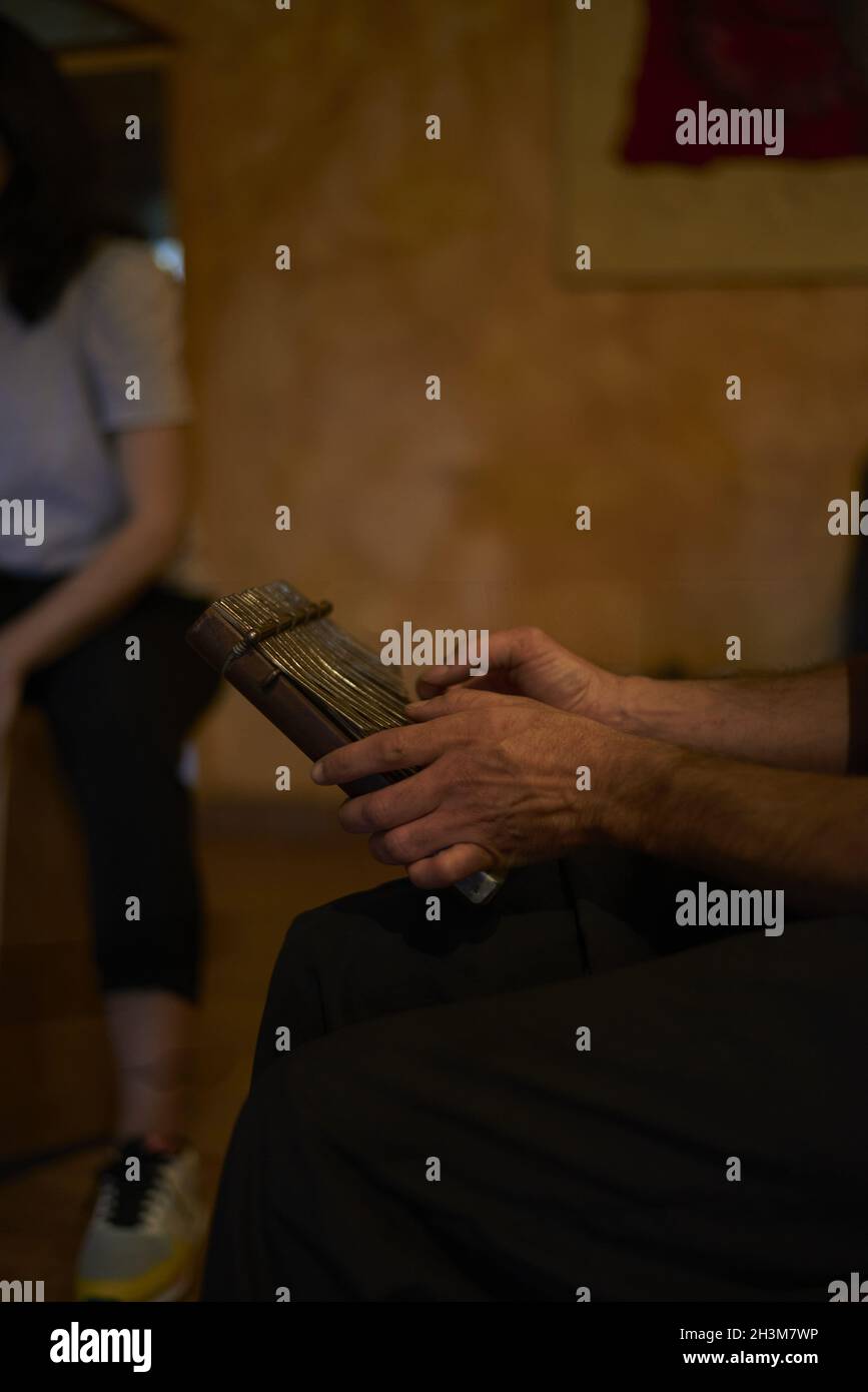 Vertical closeup of the man playing mbira Stock Photo - Alamy