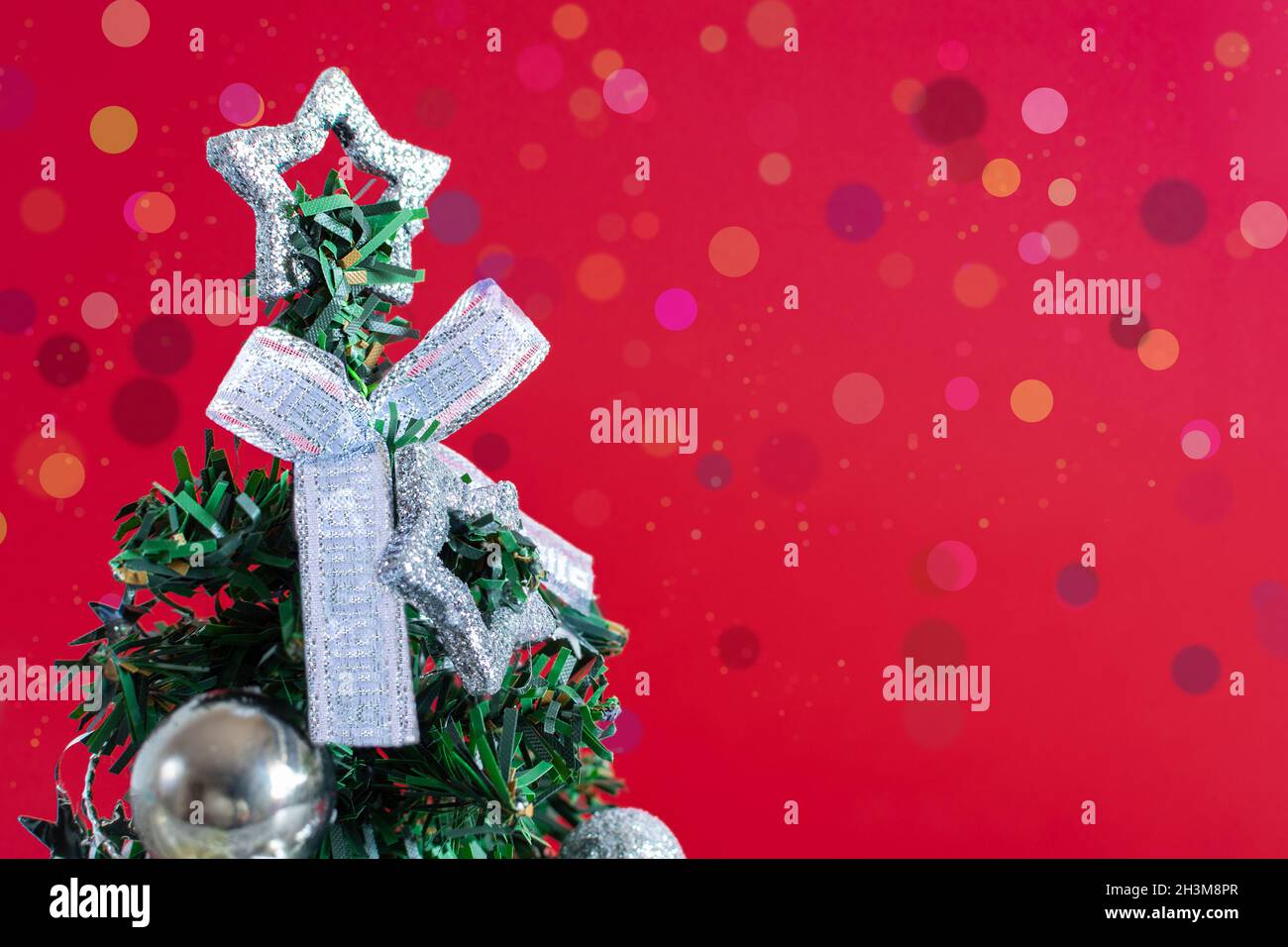 Christmas tree with silver ornaments on shiny red background Stock ...