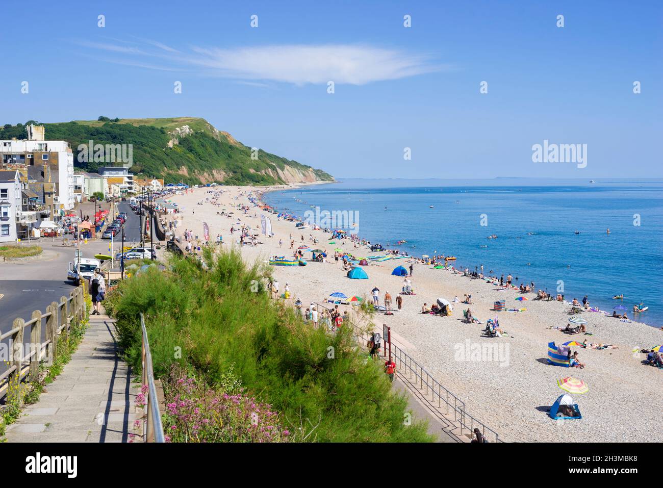 Seaton Devon - people sunbathing on the pebble beach at Seaton Devon ...