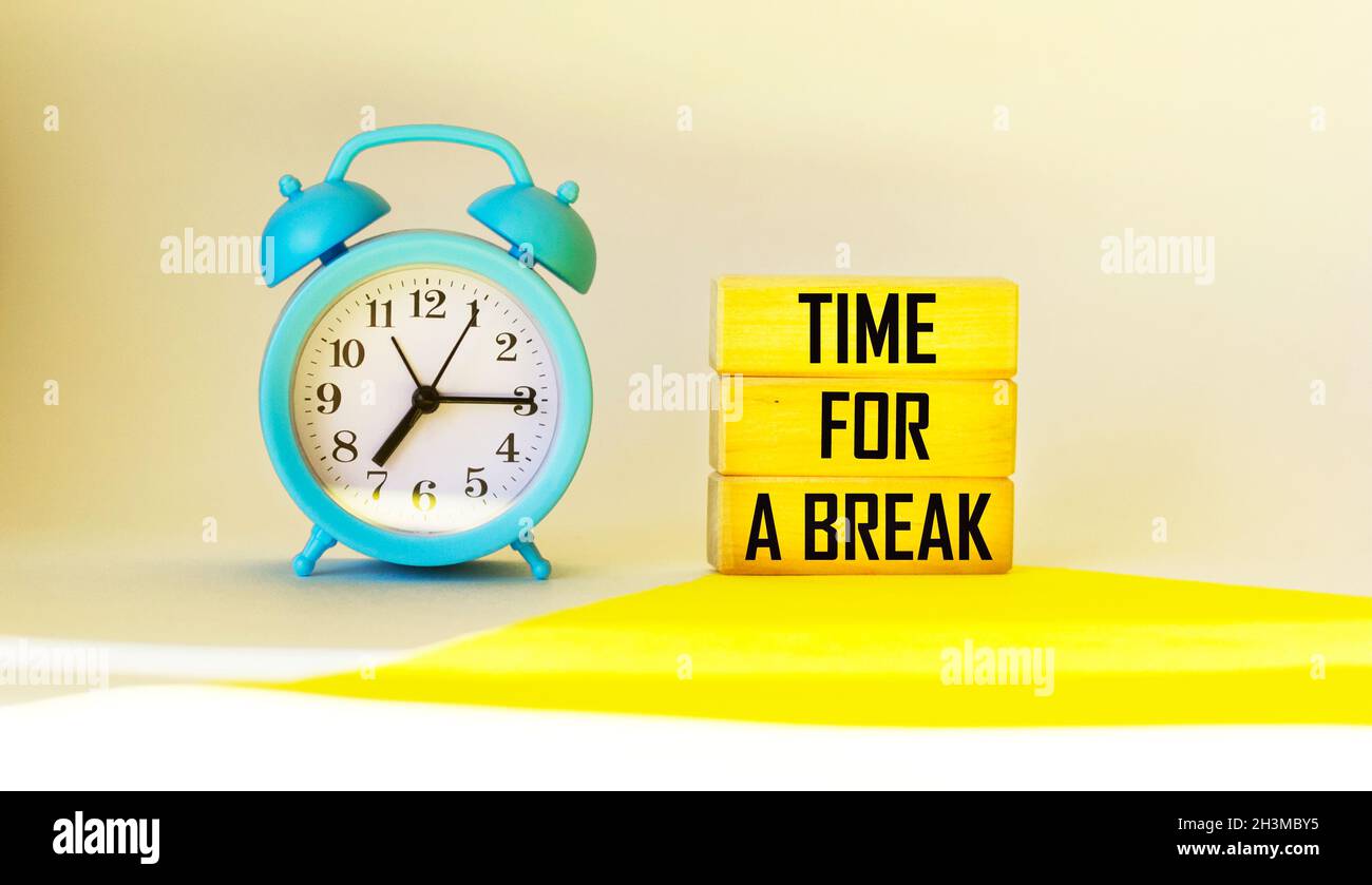 Wooden blocks with the text Time for a break, on a light background ...