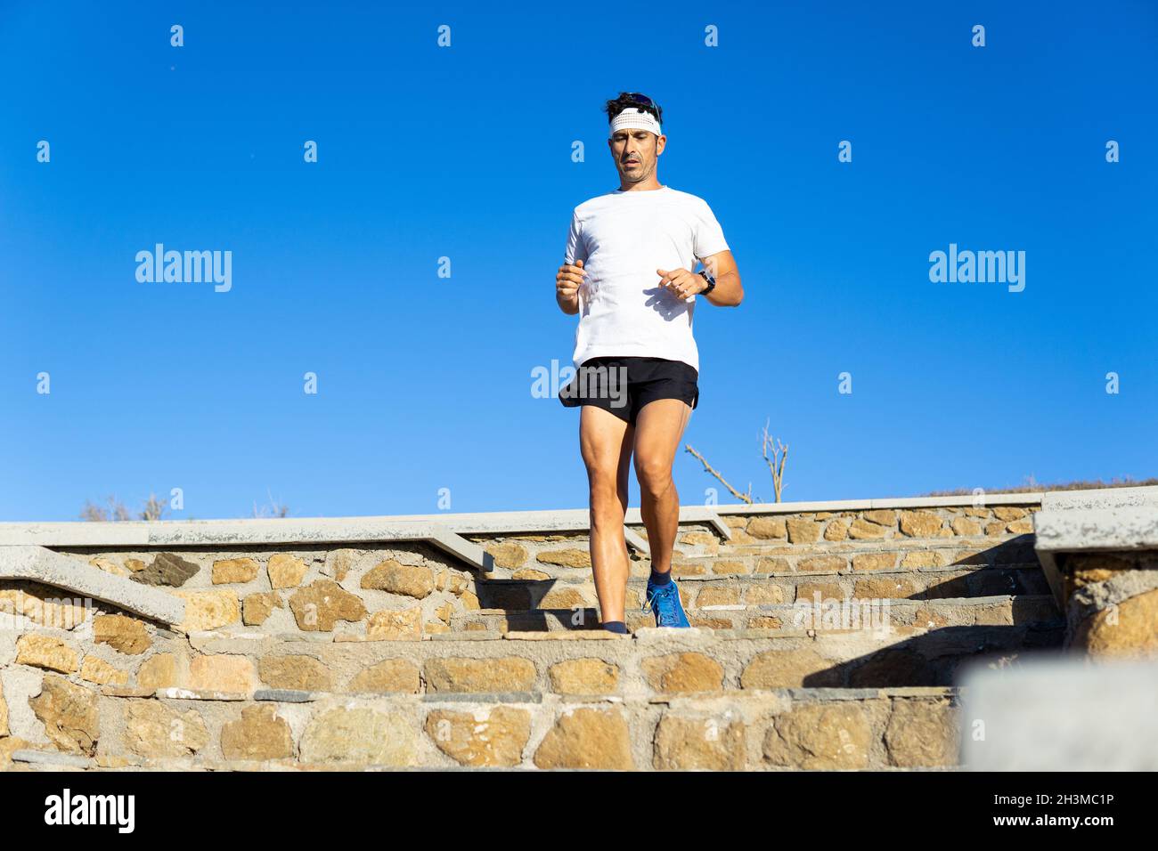 Model running down stairs hi-res stock photography and images - Alamy