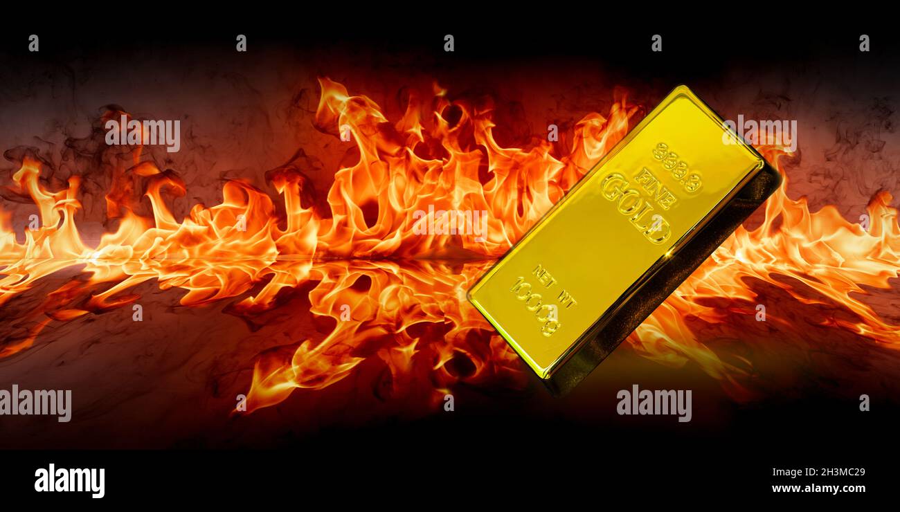 Gold bullion at fire flames burning black background Stock Photo - Alamy