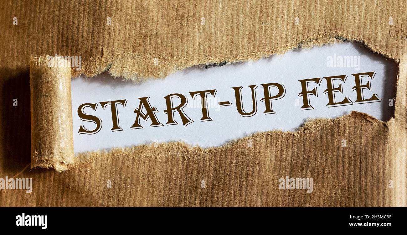 START-UP FEE - the text was printed on torn brown paper Stock Photo - Alamy