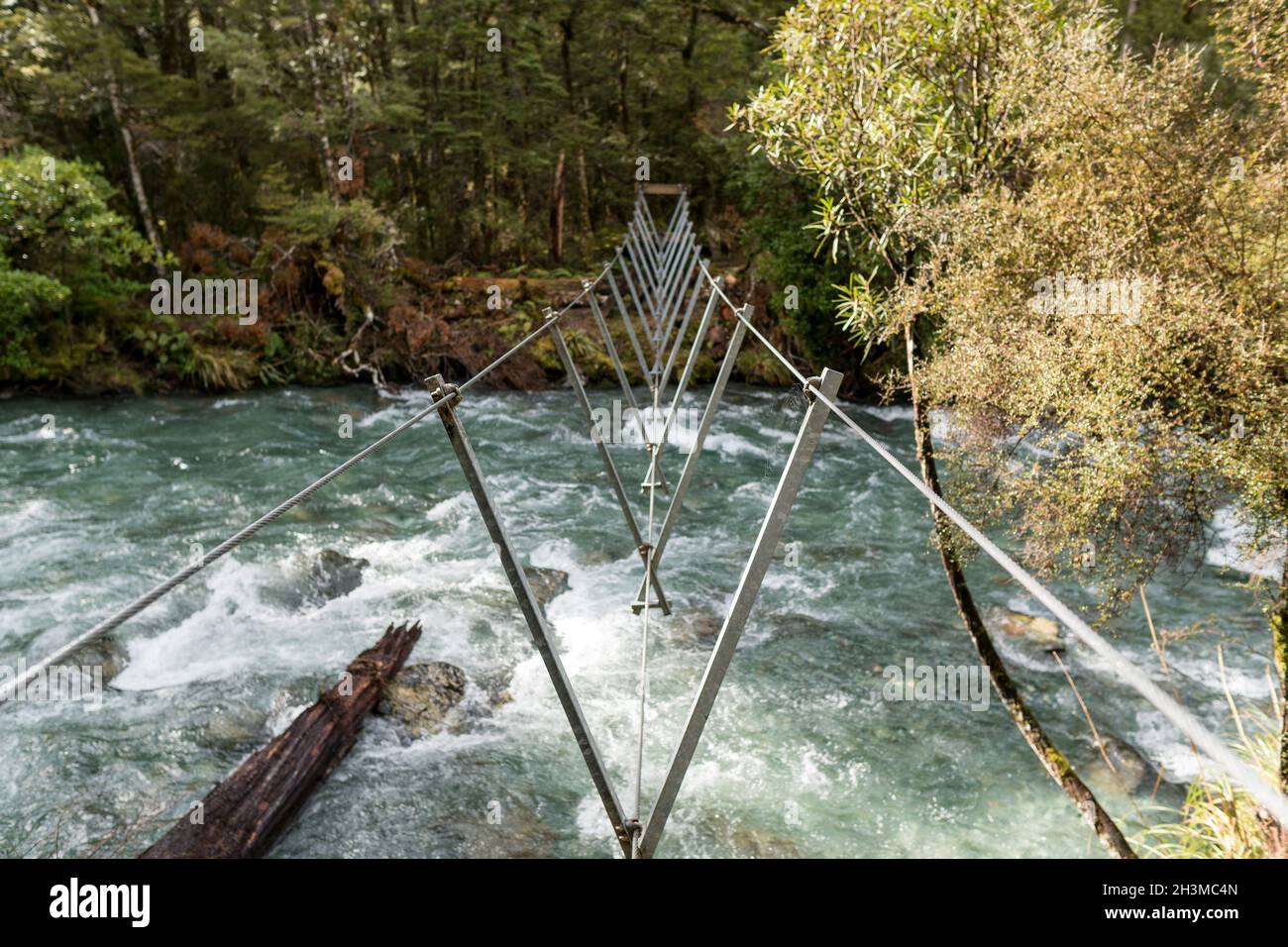 Young man crossing rope hi-res stock photography and images - Alamy