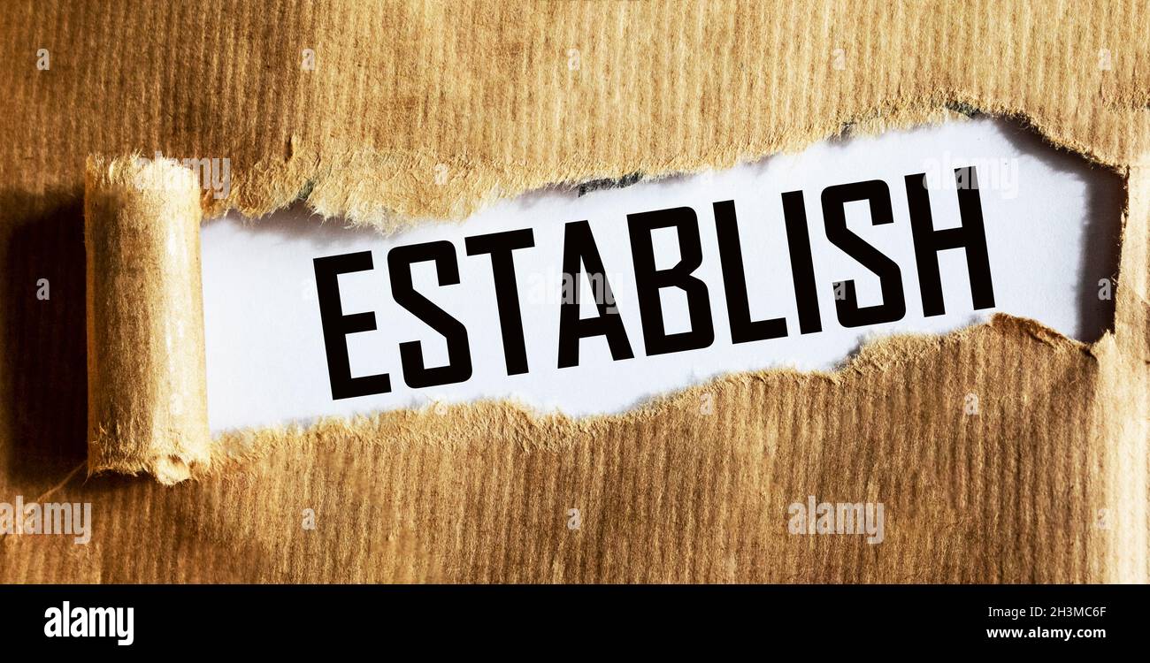 establish word concept on torn brown paper. Business and science ...